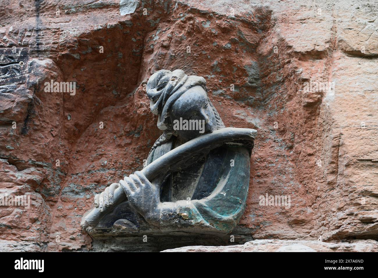Ancient Hillside Rock Carving, a woman is playing the flute- Dazu ...