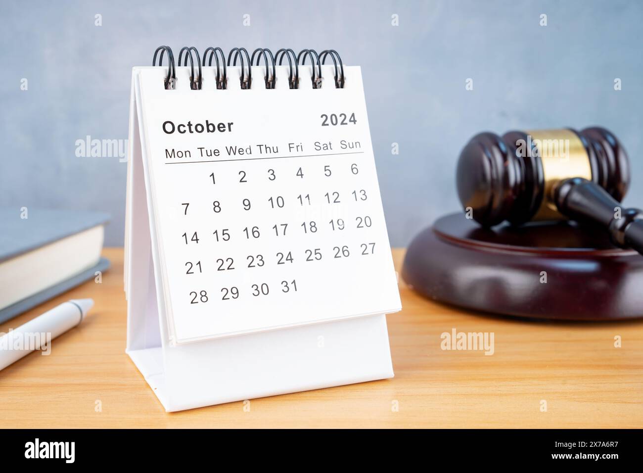 Desk calendar for October 2024 and judge's gavel on the worktable Stock ...