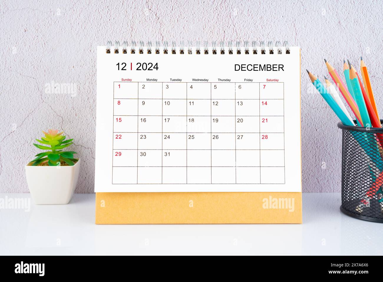 December 2024 Desk Calendar with wooden pencil on white table Stock ...