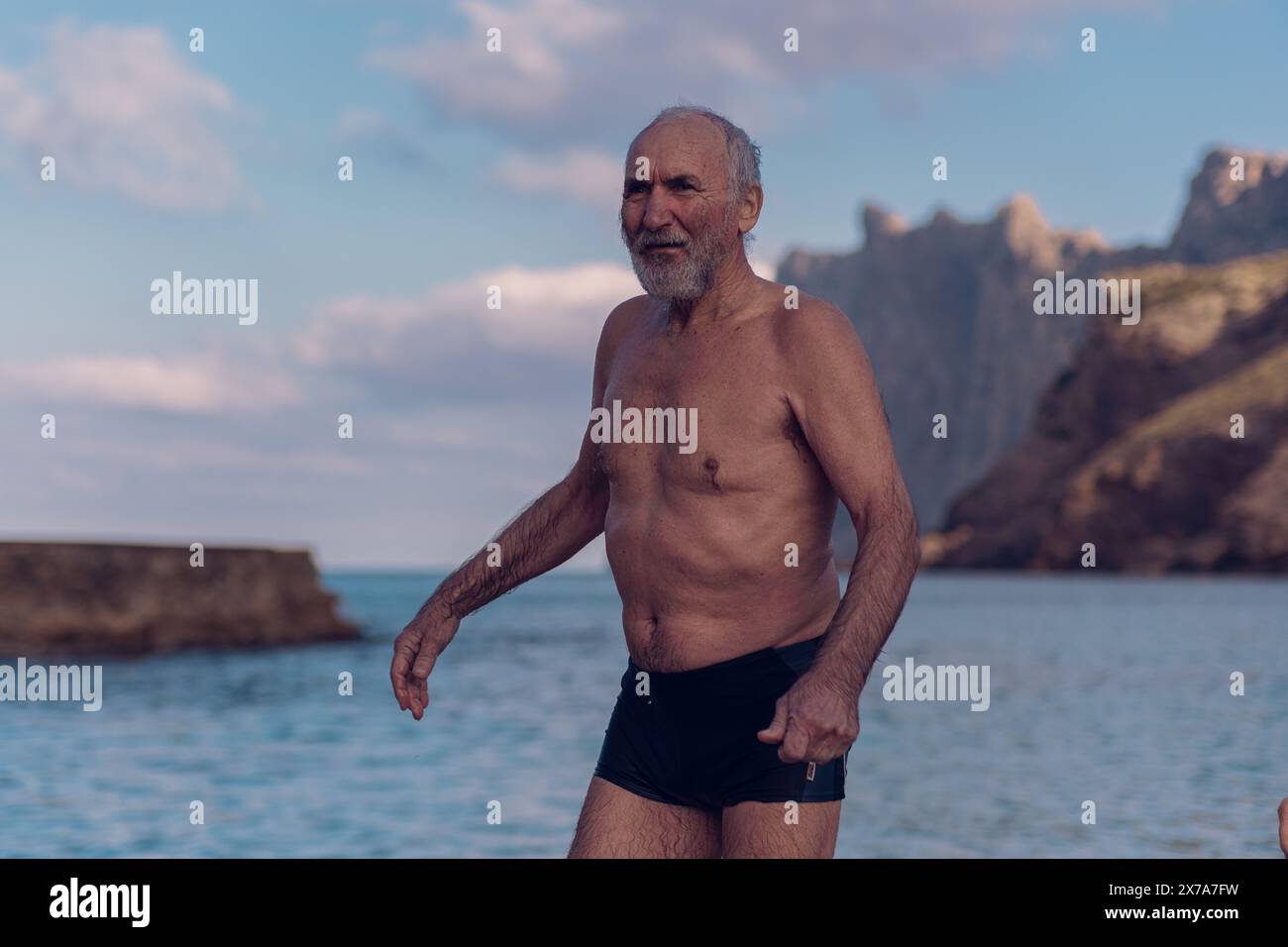 Old people swim in the sea. An elderly couple enjoys life by spending ...