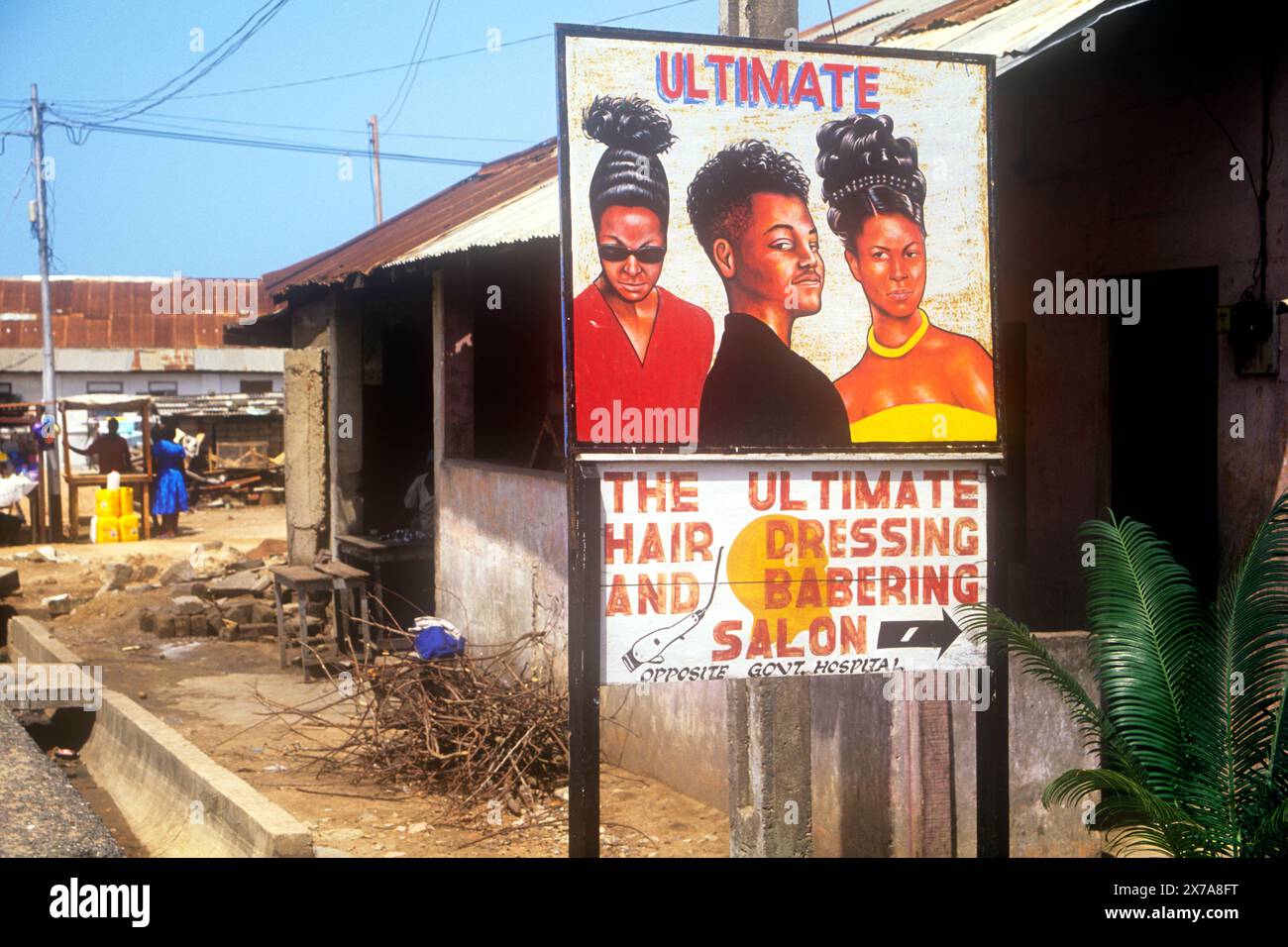 Sign advertising a barber hairdresser in a rural village in Ghana Stock ...