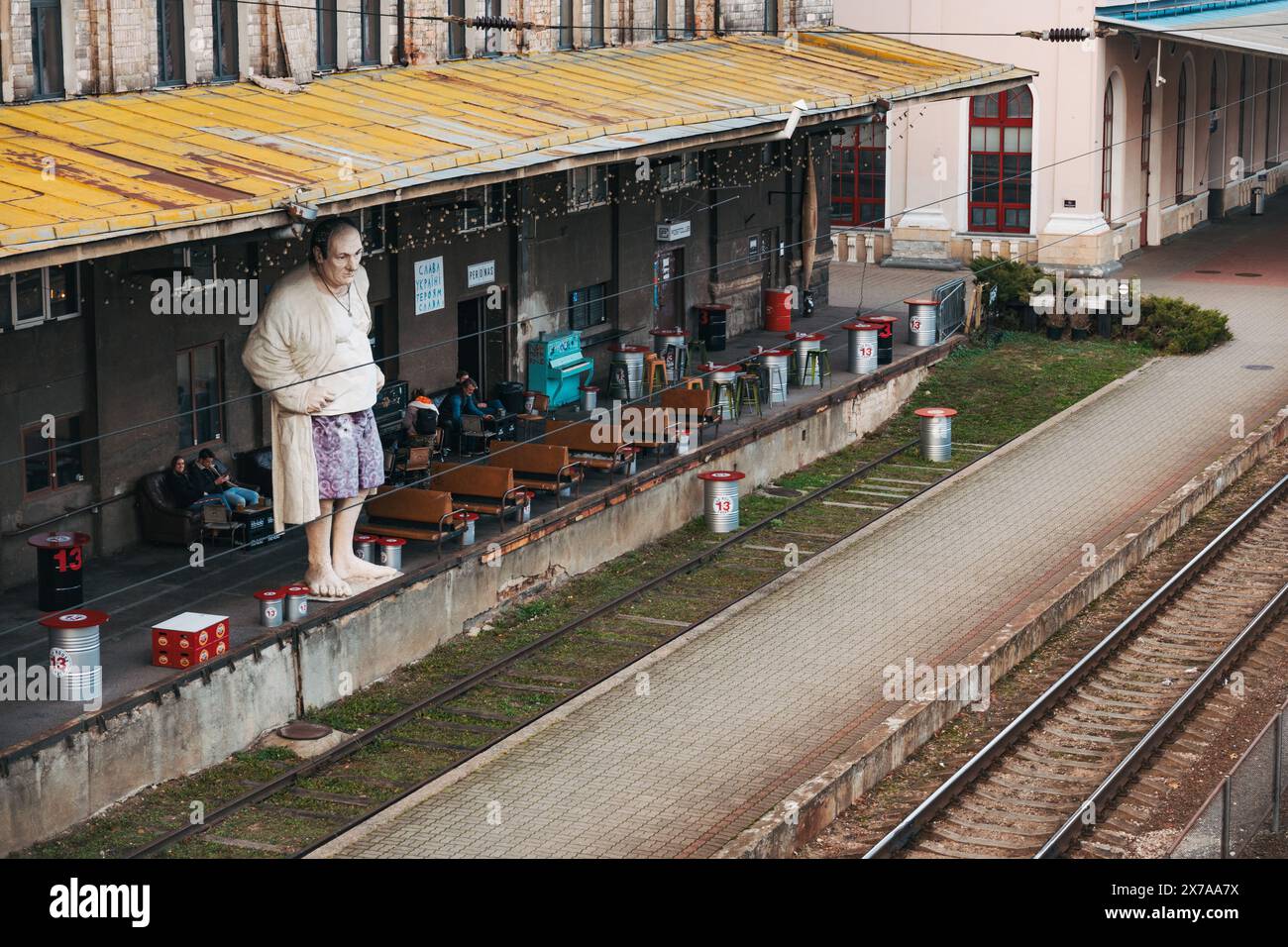 a 15-foot-tall Tony Soprano statue stands on a platform in front of a ...