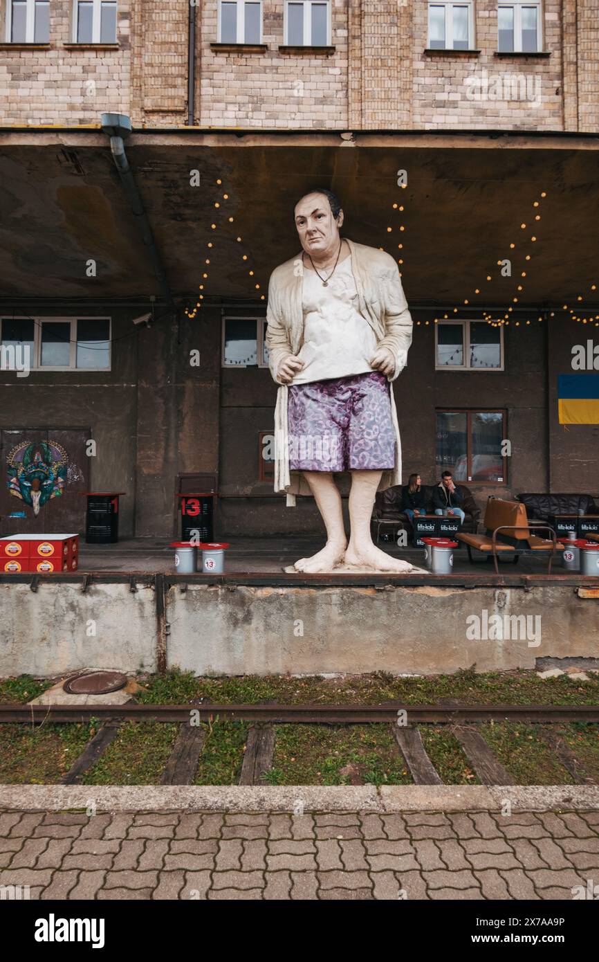 a 15-foot-tall Tony Soprano statue stands on a platform in front of a ...