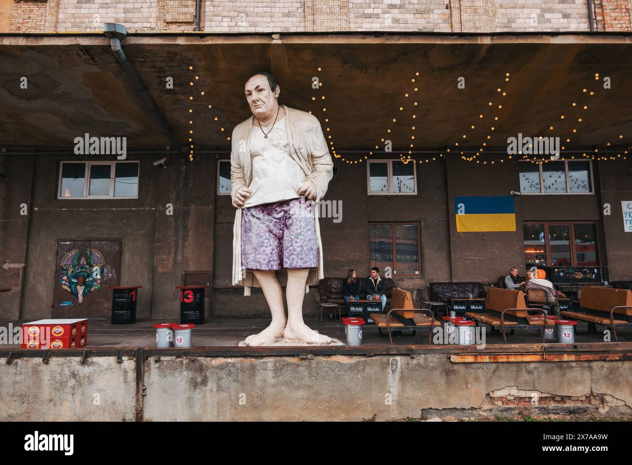 a 15-foot-tall Tony Soprano statue stands on a platform in front of a ...
