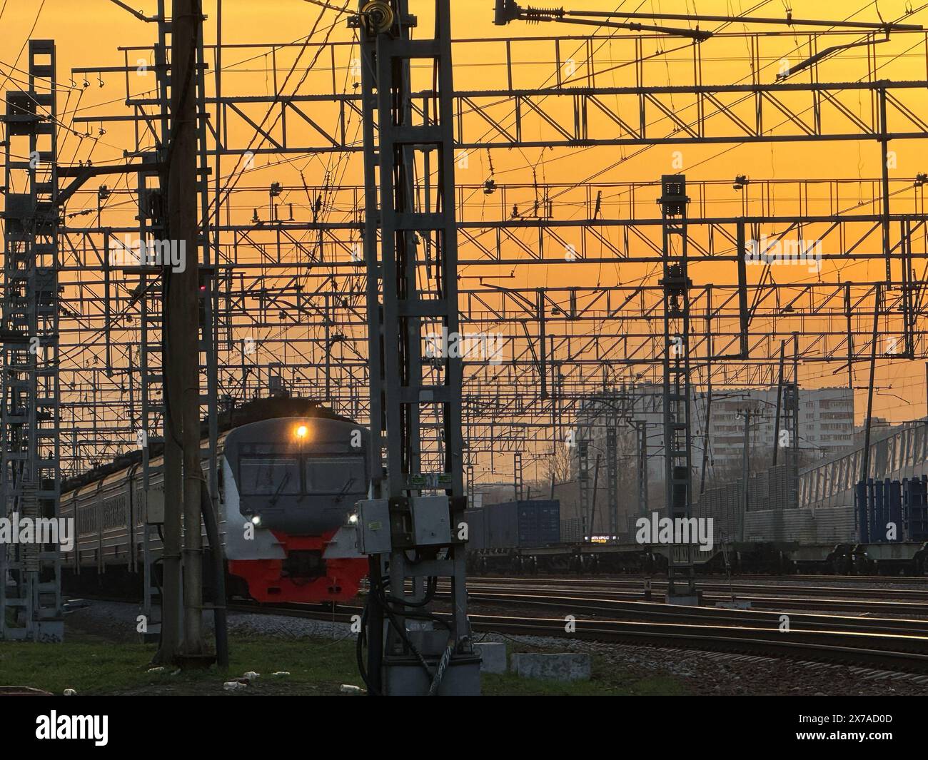 A train navigates through a complex network of power lines during ...