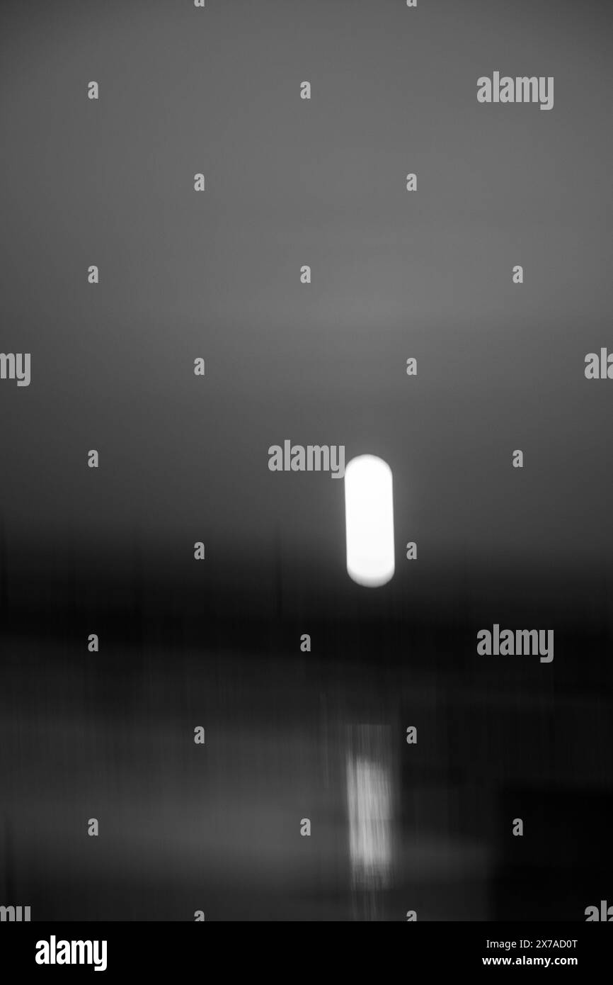 Abstract, blurry black and white photograph capturing a single ...