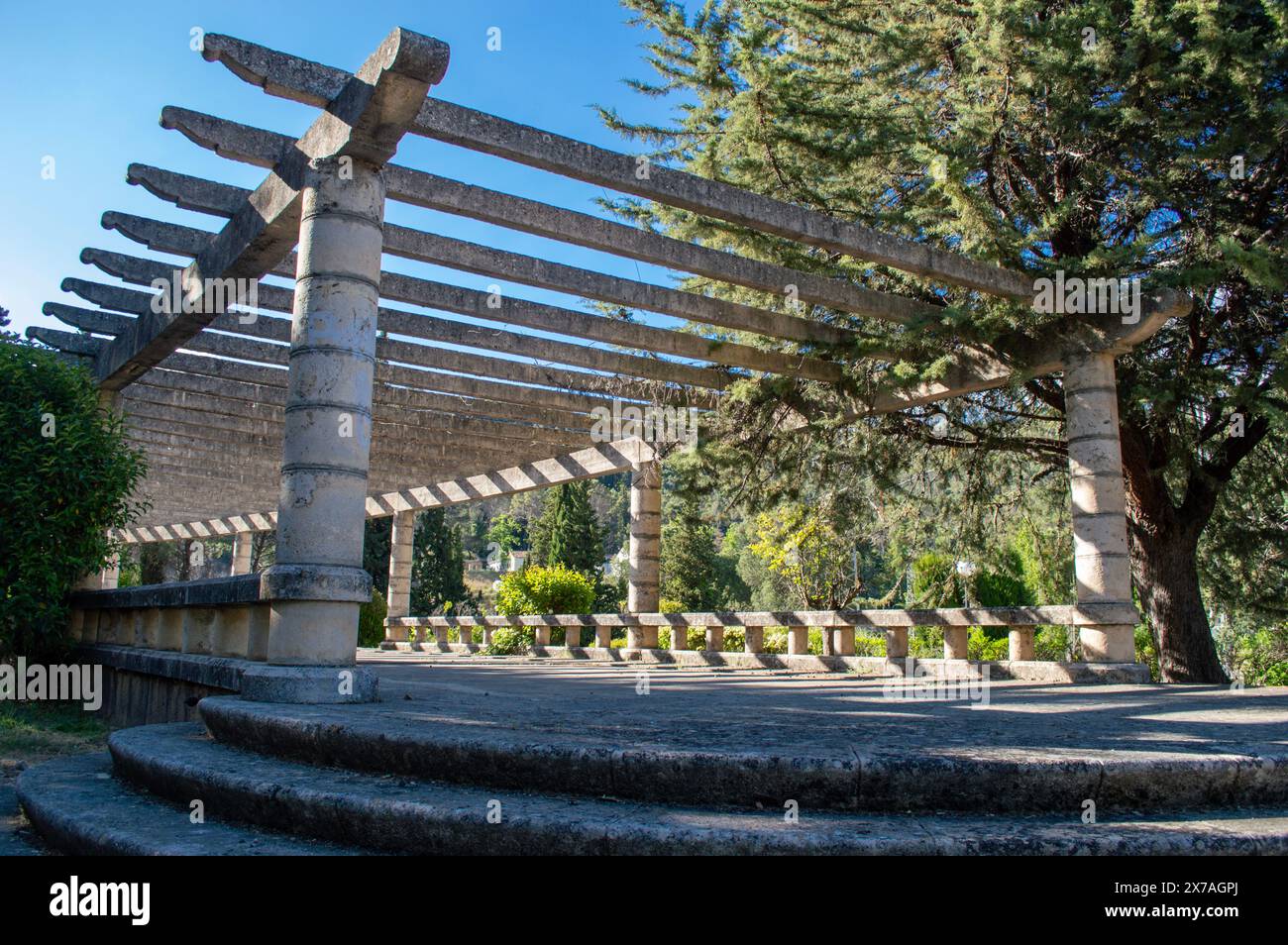 Stone pergola in the Entrepeñas gardens Stock Photo - Alamy