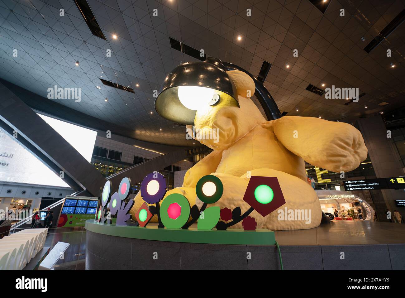 DOHA, QATAR - OCTOBER 13, 2023: Lamp Bear sculpture in Doha’s Hamad International Airport Stock ...