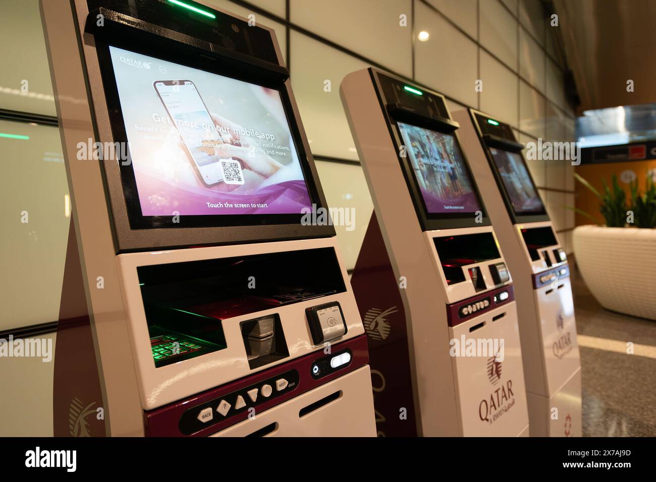 DOHA, QATAR - OCTOBER 13, 2023: Qatar Airways self service kiosks as ...