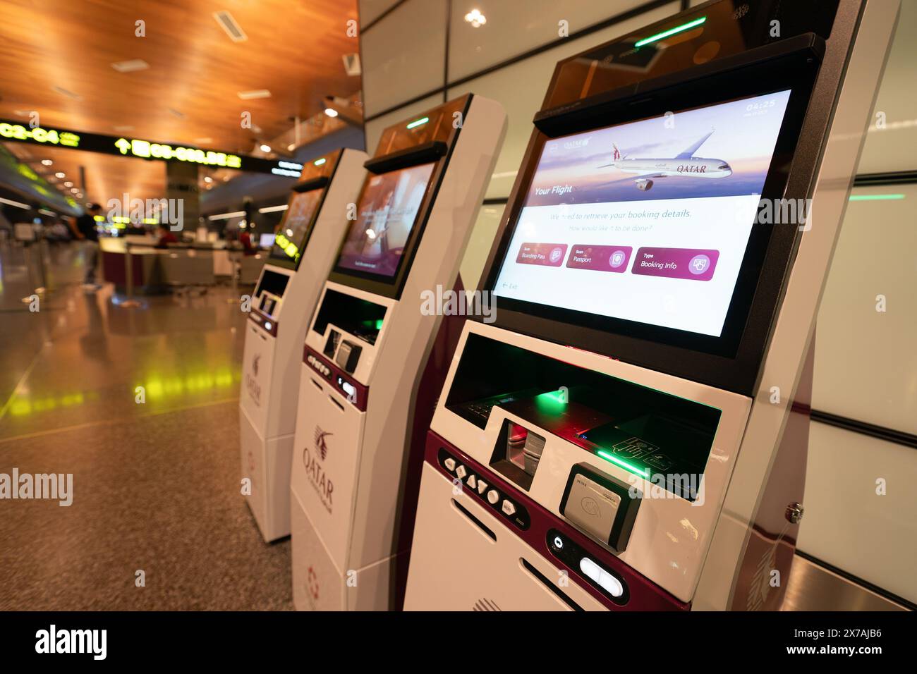 DOHA, QATAR - OCTOBER 13, 2023: Qatar Airways self service kiosks as ...