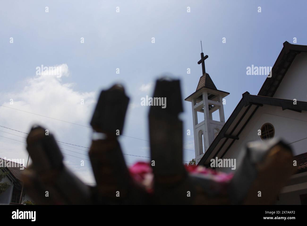 Tower of a church with a cross decoration as a symbol of obedience ...
