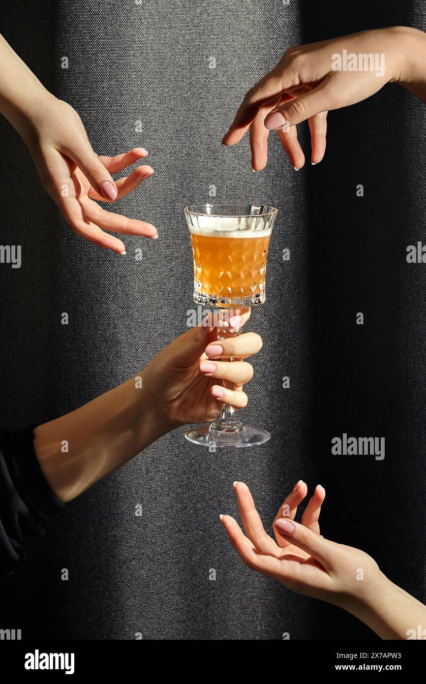 Female hands hovering around crystal glass of whiskey sour Stock Photo ...