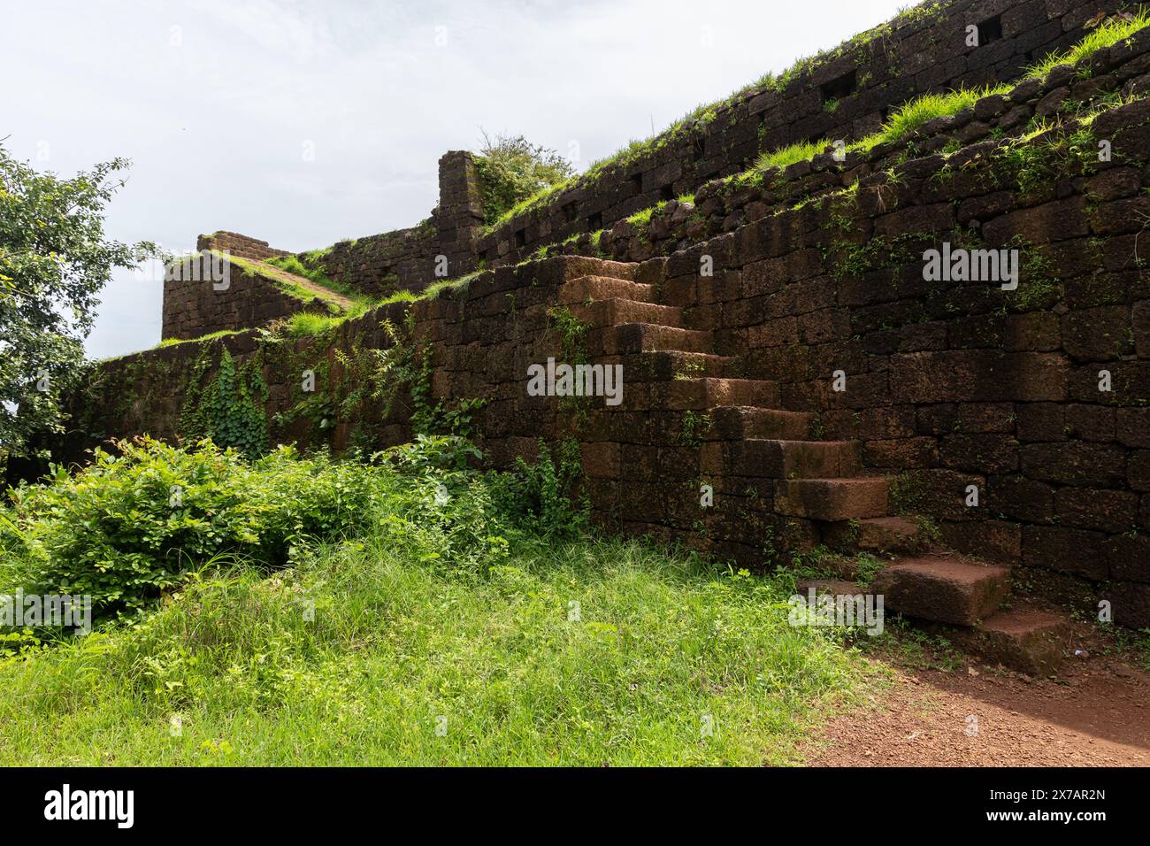 Massive walls of Cabo de Rama Fort as seen during monsoon season in ...