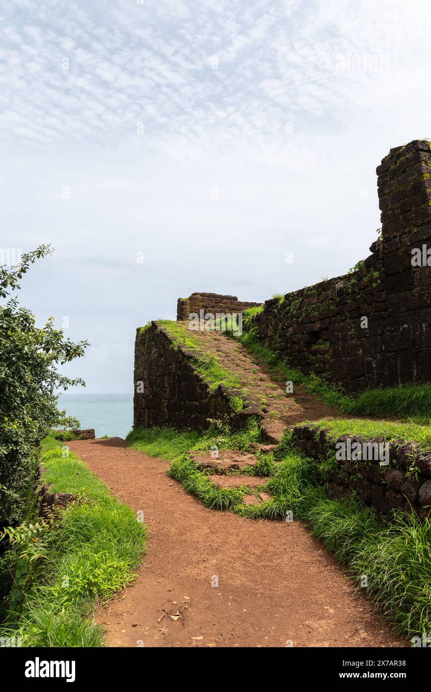 Massive walls of Cabo de Rama Fort as seen during monsoon season in ...