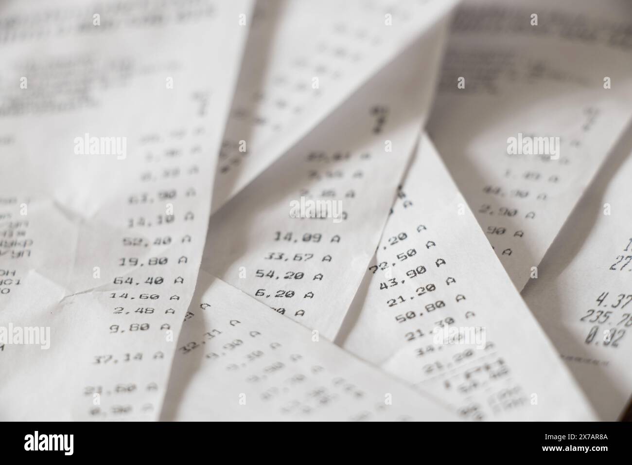 Receipts from Ukrainian grocery stores as a background, a lot of ...