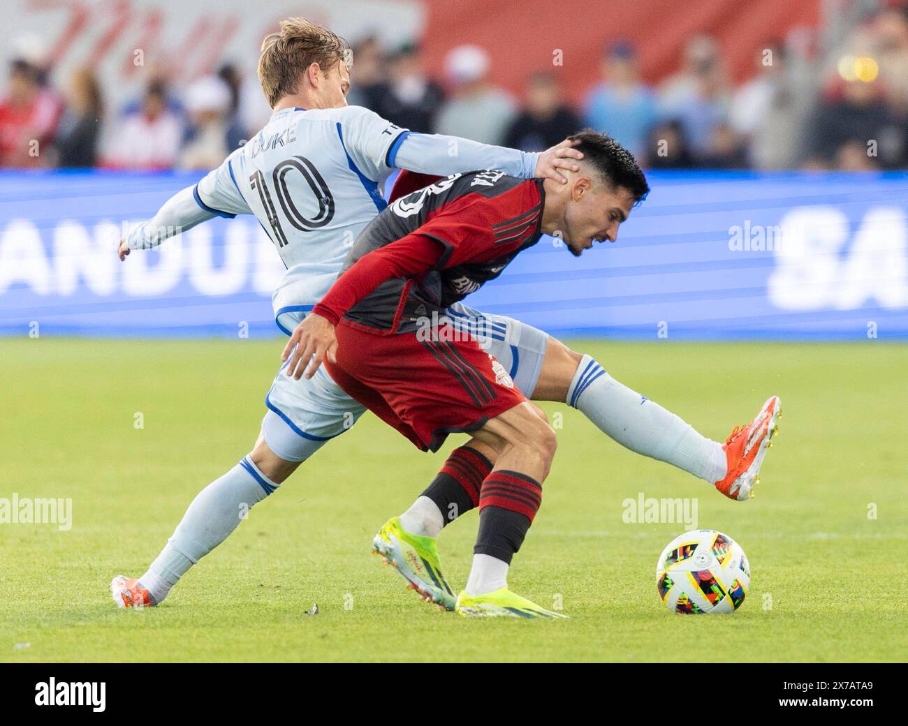 Toronto, Canada. 18th May, 2024. Bryce Duke (L) of CF Montreal vies ...
