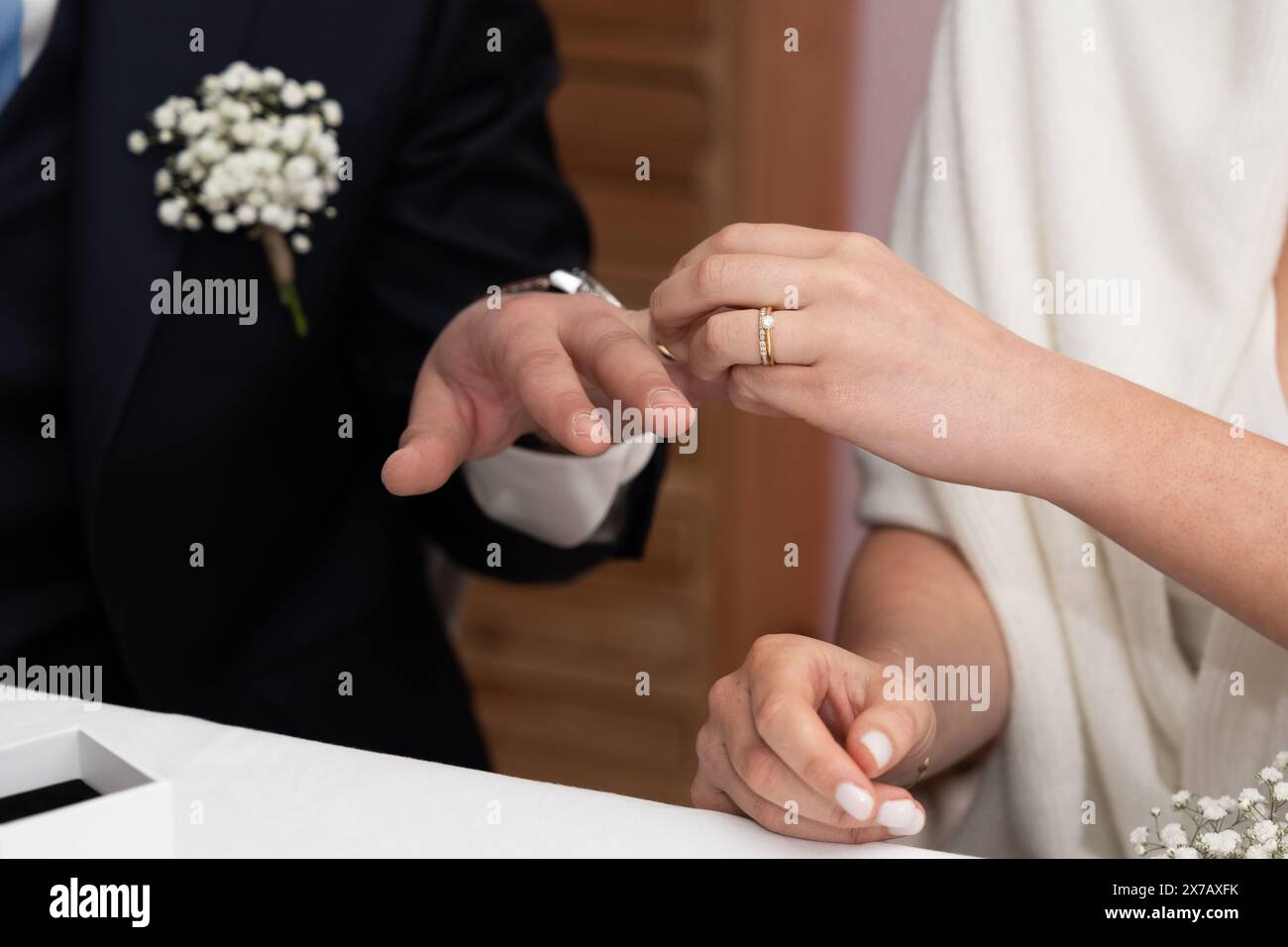 Woman puts on wedding ring hi-res stock photography and images - Alamy