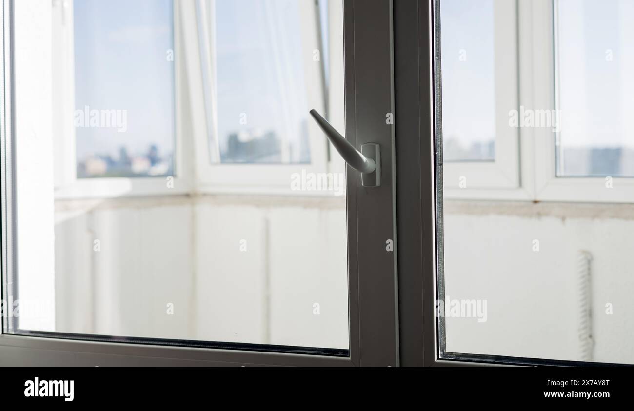 Window handle detail. pvc double glazing Stock Photo - Alamy