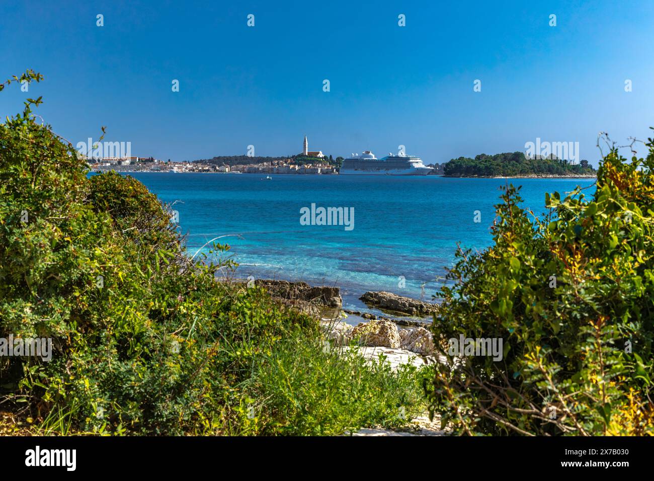 A huge tourist ship enters the port of Rovinj, sailing on the Adriatic ...