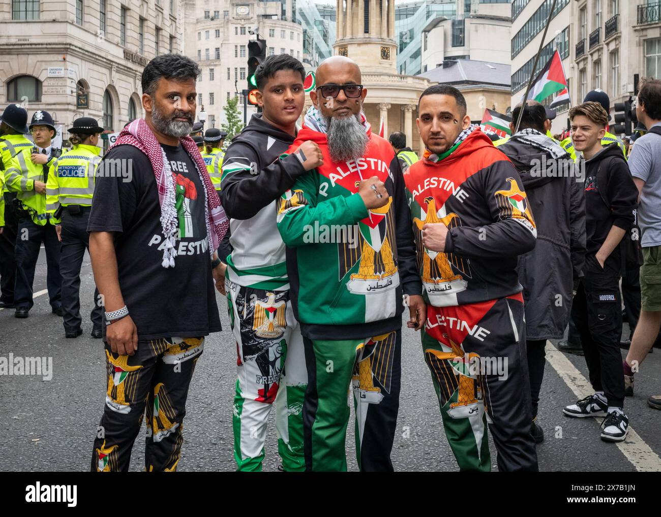 London, UK. 18 May 2024: Four muslim men dressed in colourful pro ...