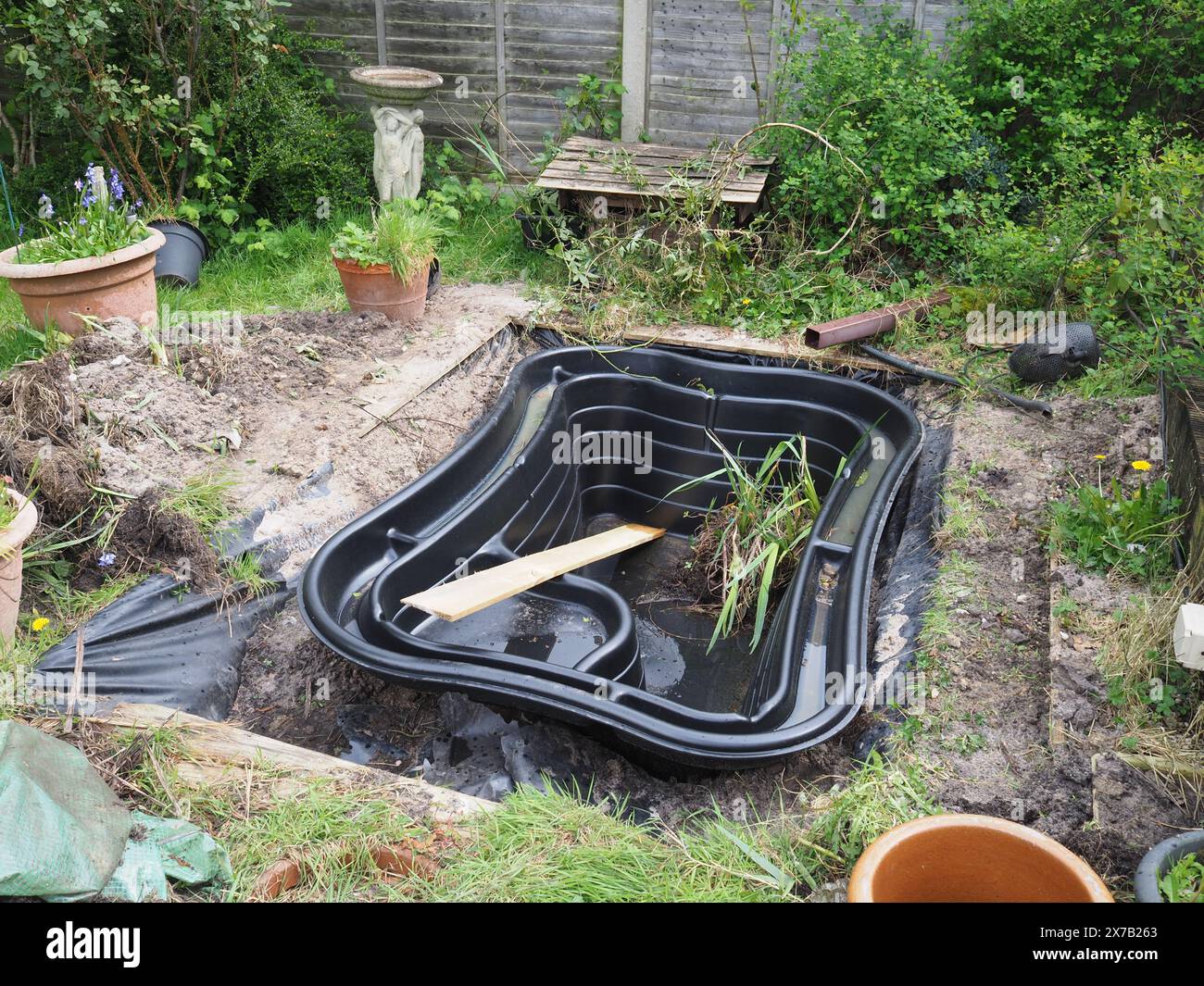 A newly installed preformed pond before it is filled with water Stock ...