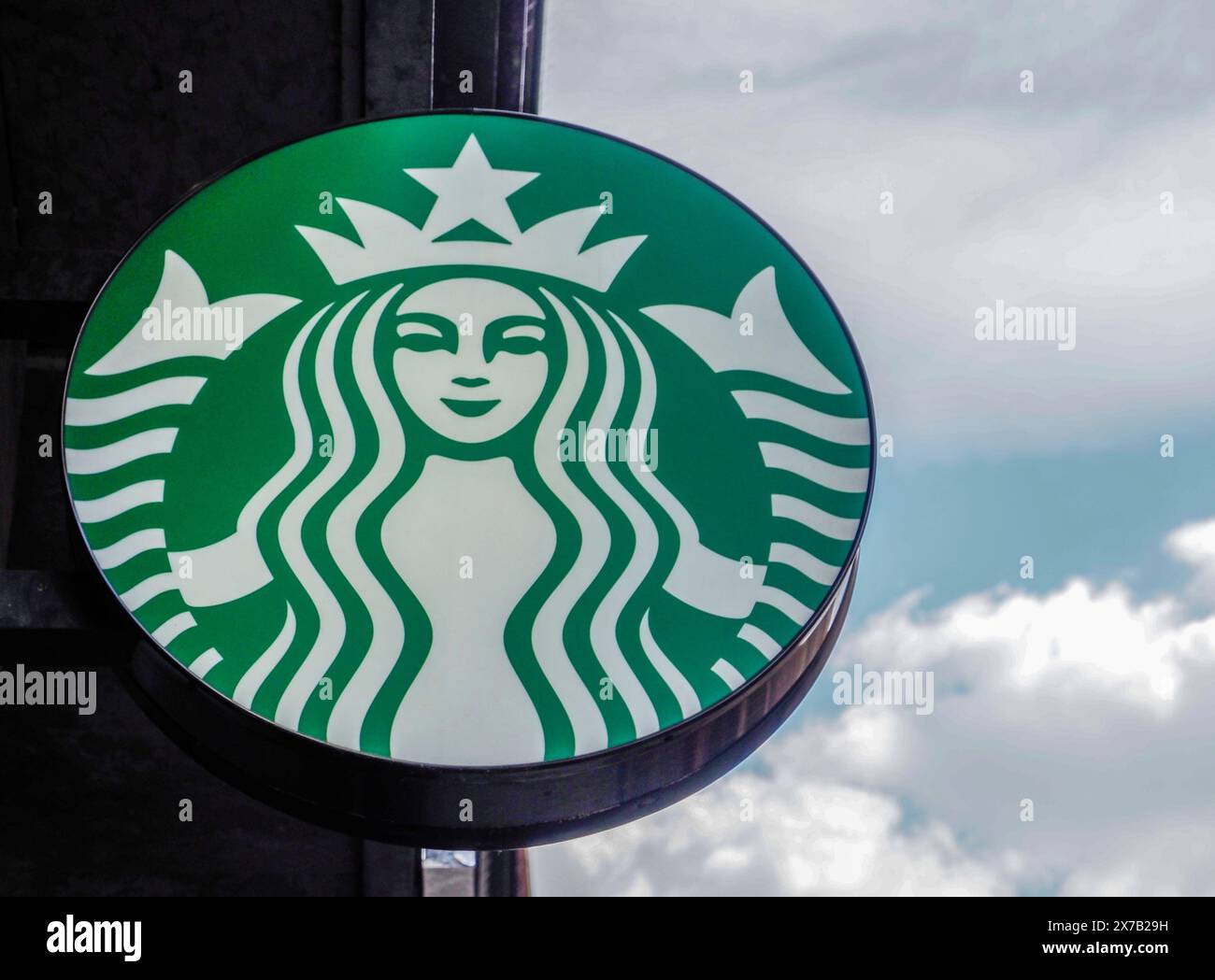 Prague, Czech Republic - May 10, 2024: A bright green Starbucks coffee ...