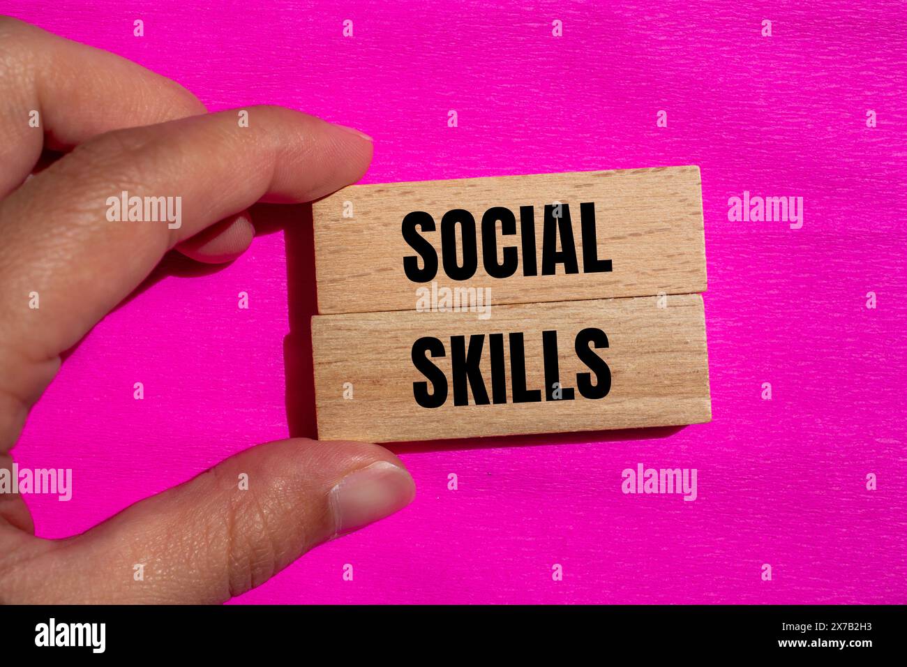 Social skills words written on wooden blocks with pink background ...
