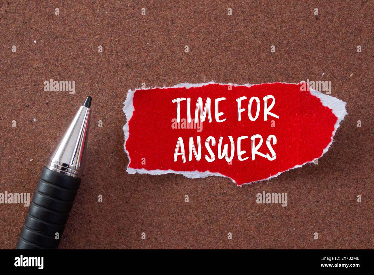 Time for answers words written on ripped red paper with brown ...