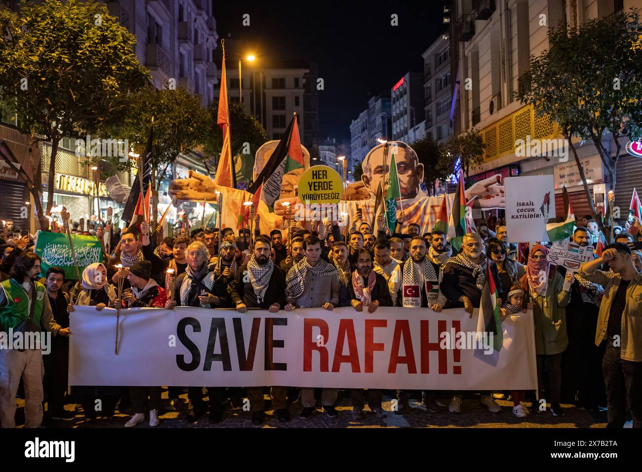 Protesters move towards Eminonu Square holding a banner saying "SAVE ...