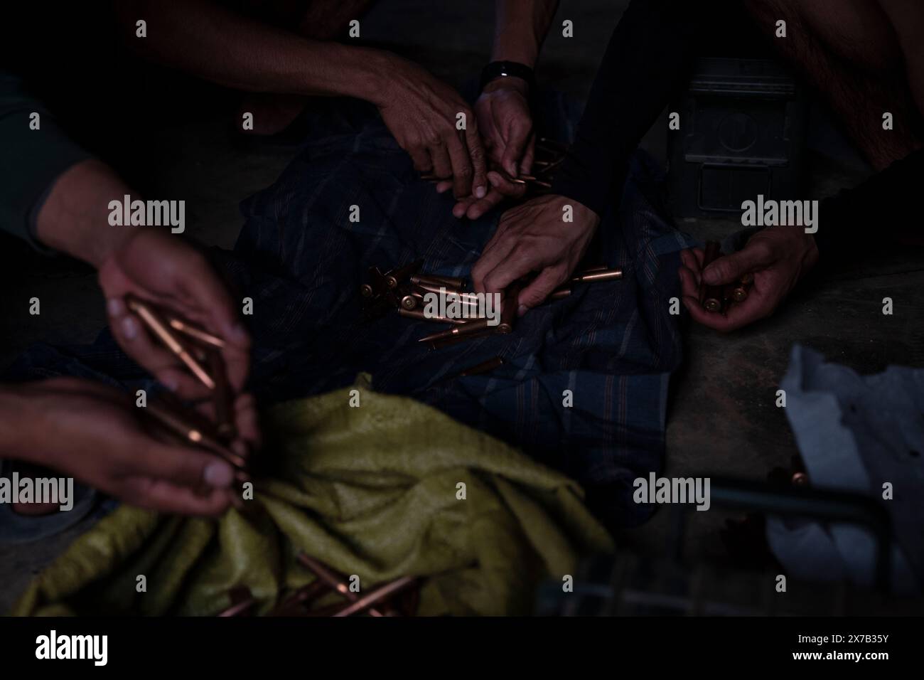 Karenni soldiers count and sort bullets in Karenni State, Myanmar Stock ...