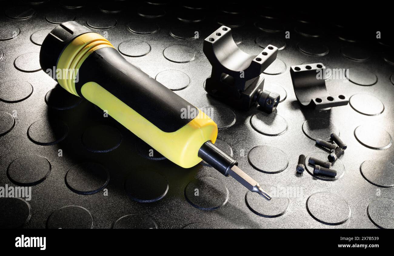 Handtool that measures a bolts tightness in inch pounds next to the ...