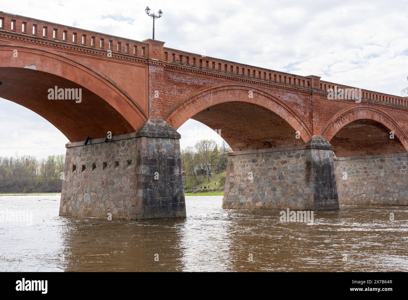 The old red brick bridge across the Venta river. Kuldiga, Latvia Stock ...
