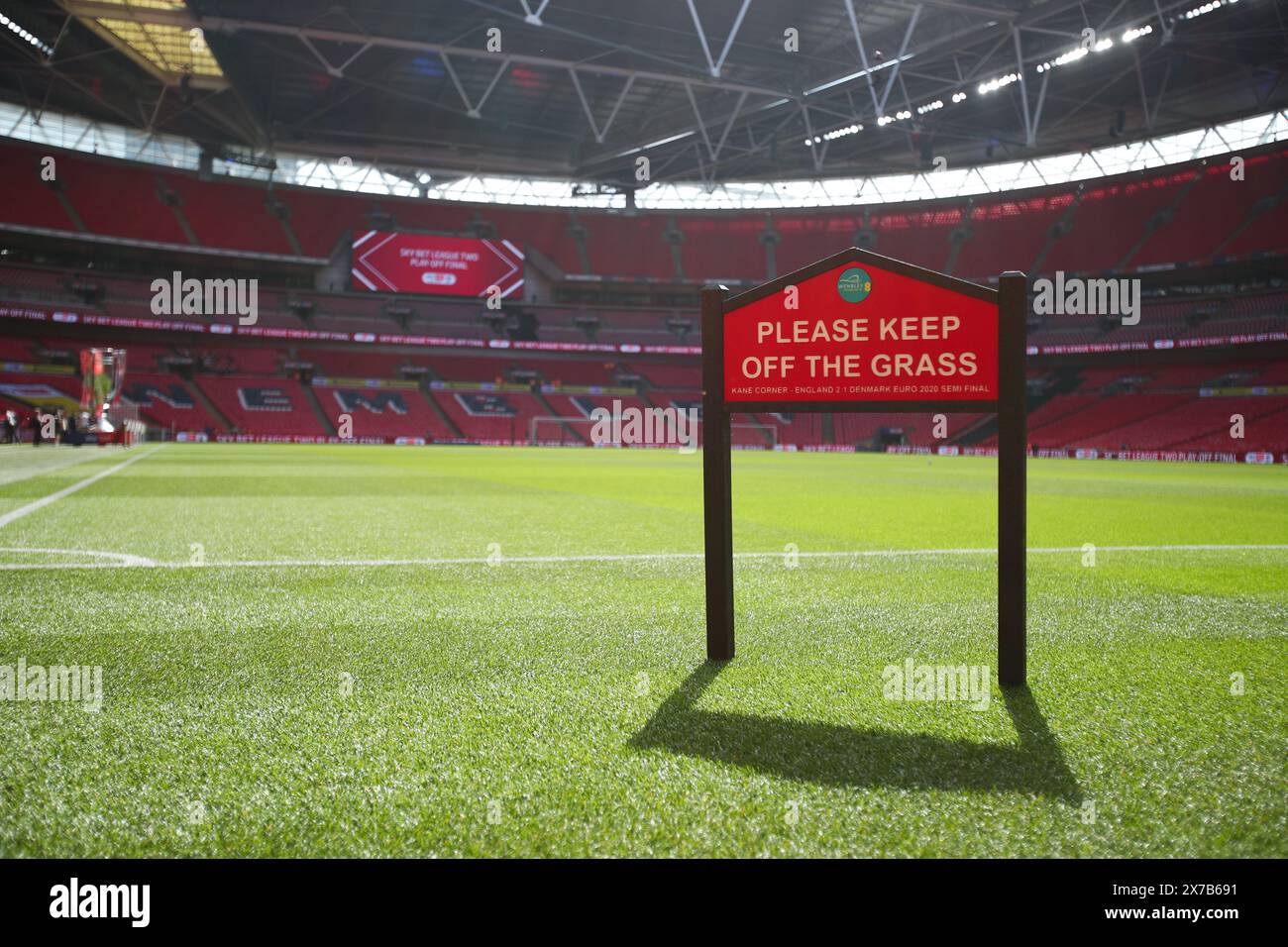 A general view of a please keep of the grass sign at Wembley Stadium ...