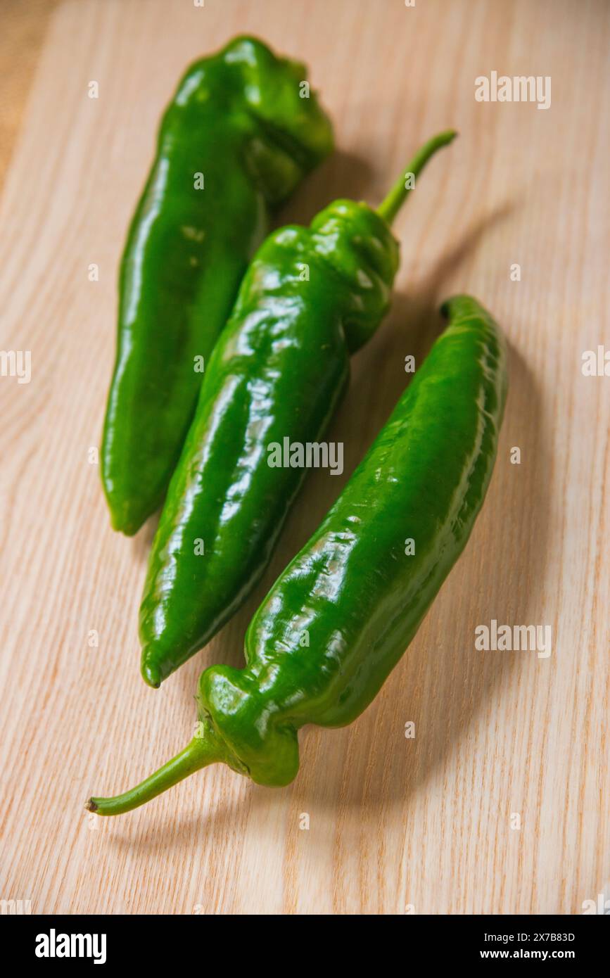 Three green peppers Stock Photo - Alamy