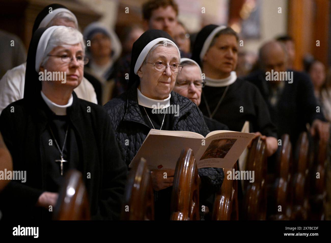 Nuns listen during a Pentecost Vigil at Blessed Michael McGivney Parish ...