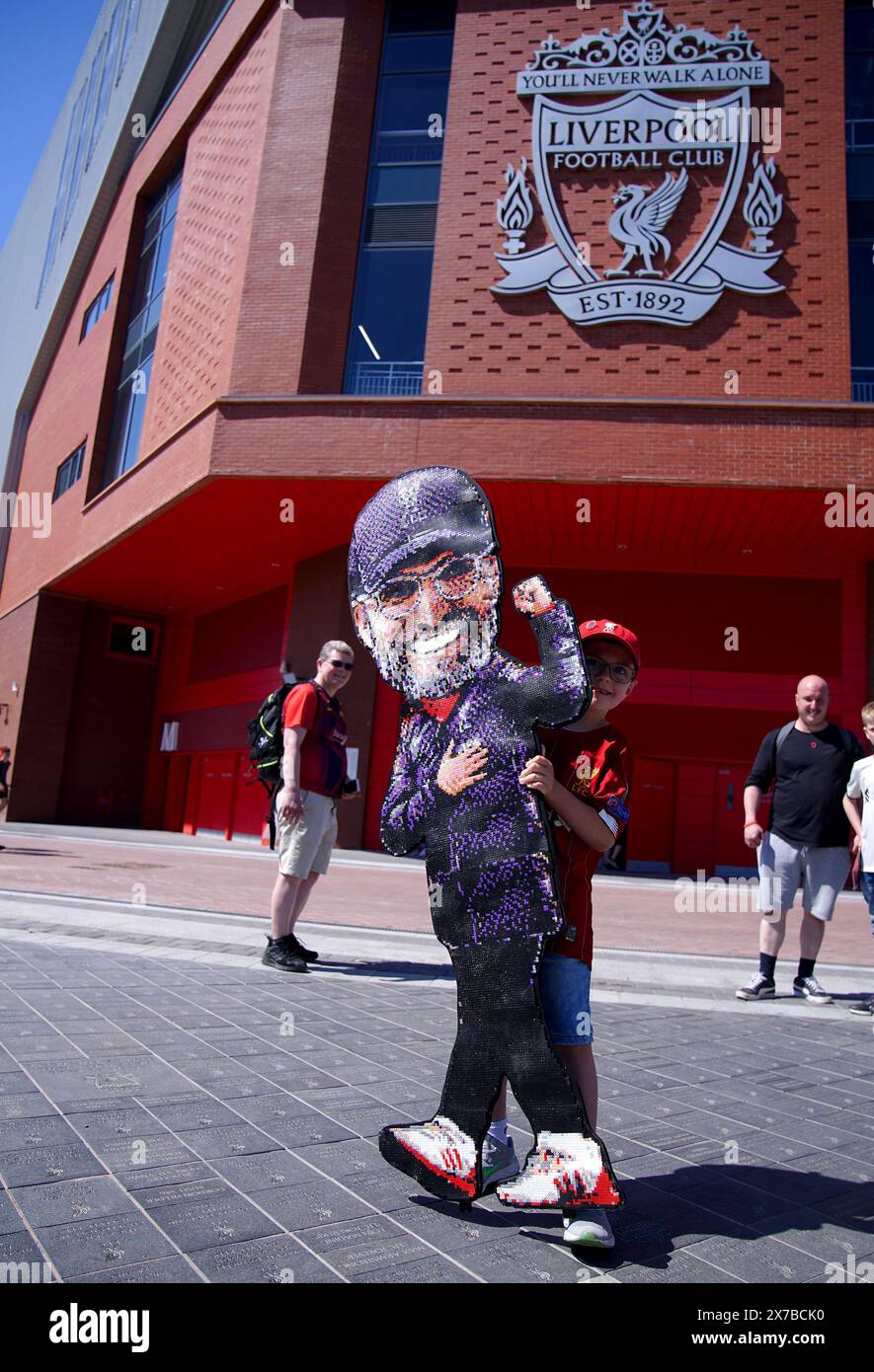 A Liverpool fan holds up a design of Jurgen Klopp made out of perler ...