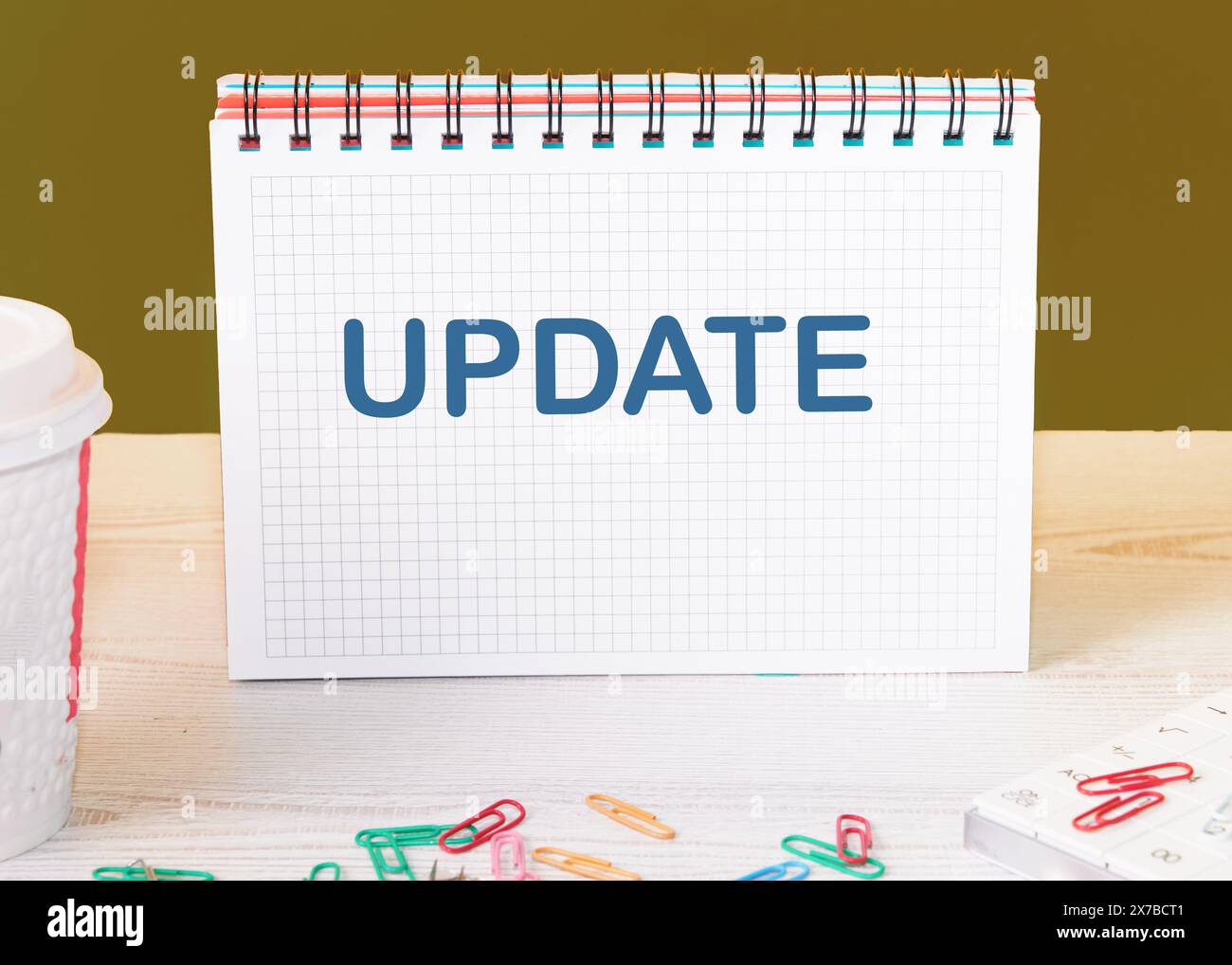 Business concept. UPDATE text on a checkered notebook on the office ...