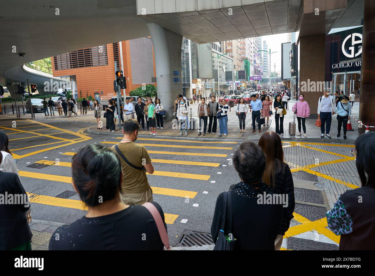 HONG KONG, CHINA - DECEMBER 05, 2023: many people waiting at crosswalk ...