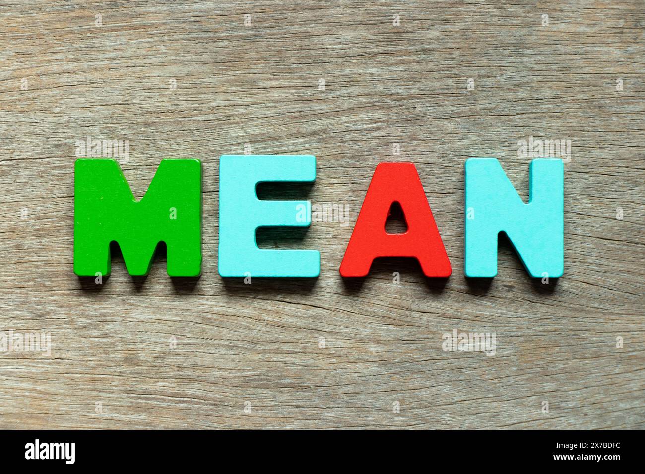 Color alphabet letter in word mean on wood background Stock Photo - Alamy