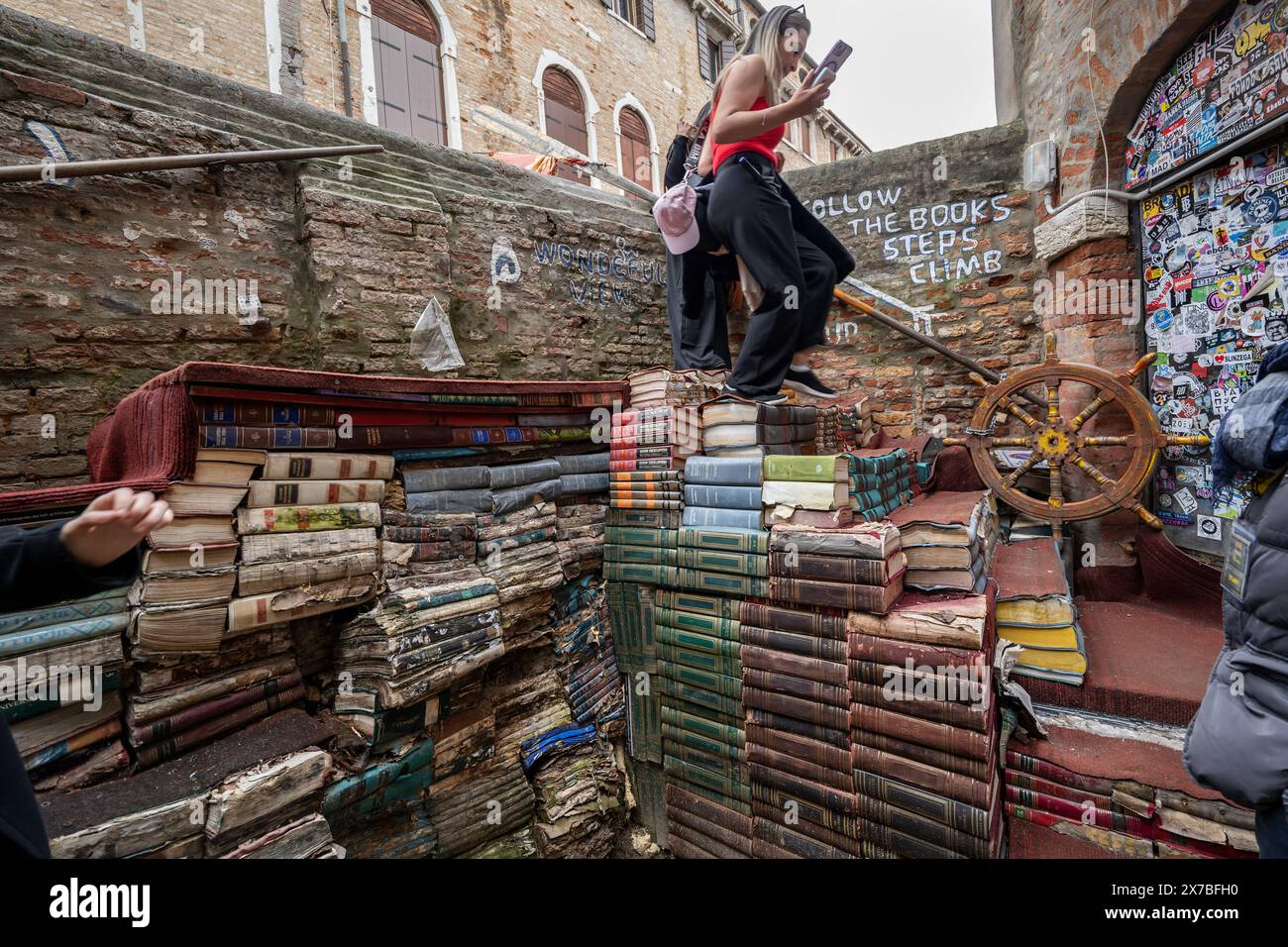 Acqua Alta Library, famous bookstore in city of Venice, Italy. Outside ...