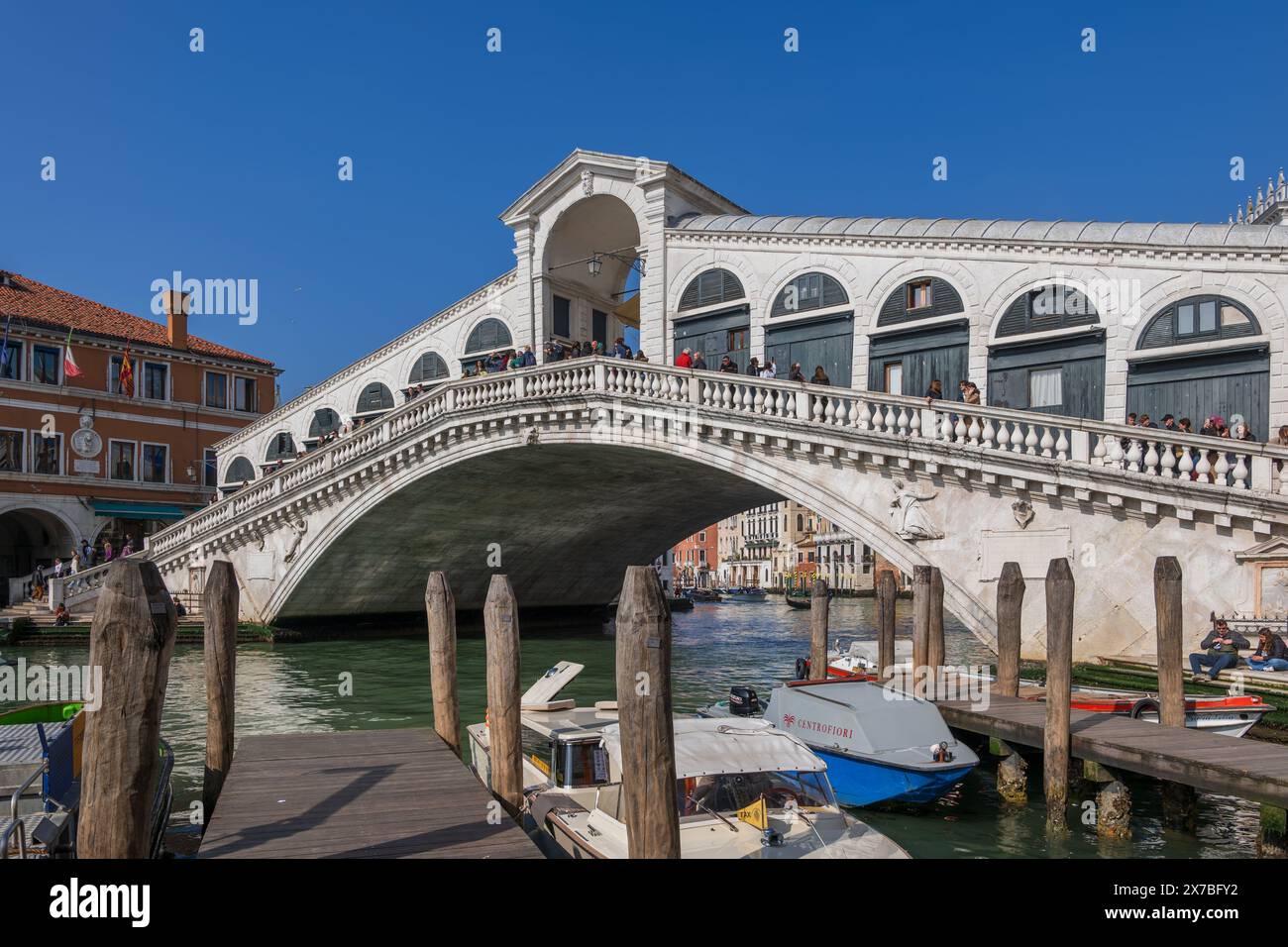 The Rialto Bridge across Grand Canal in city of Venice, Italy. Stone ...
