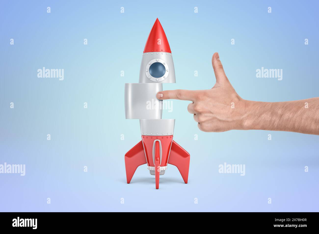 Hand points at rocket suggesting launch Stock Photo - Alamy