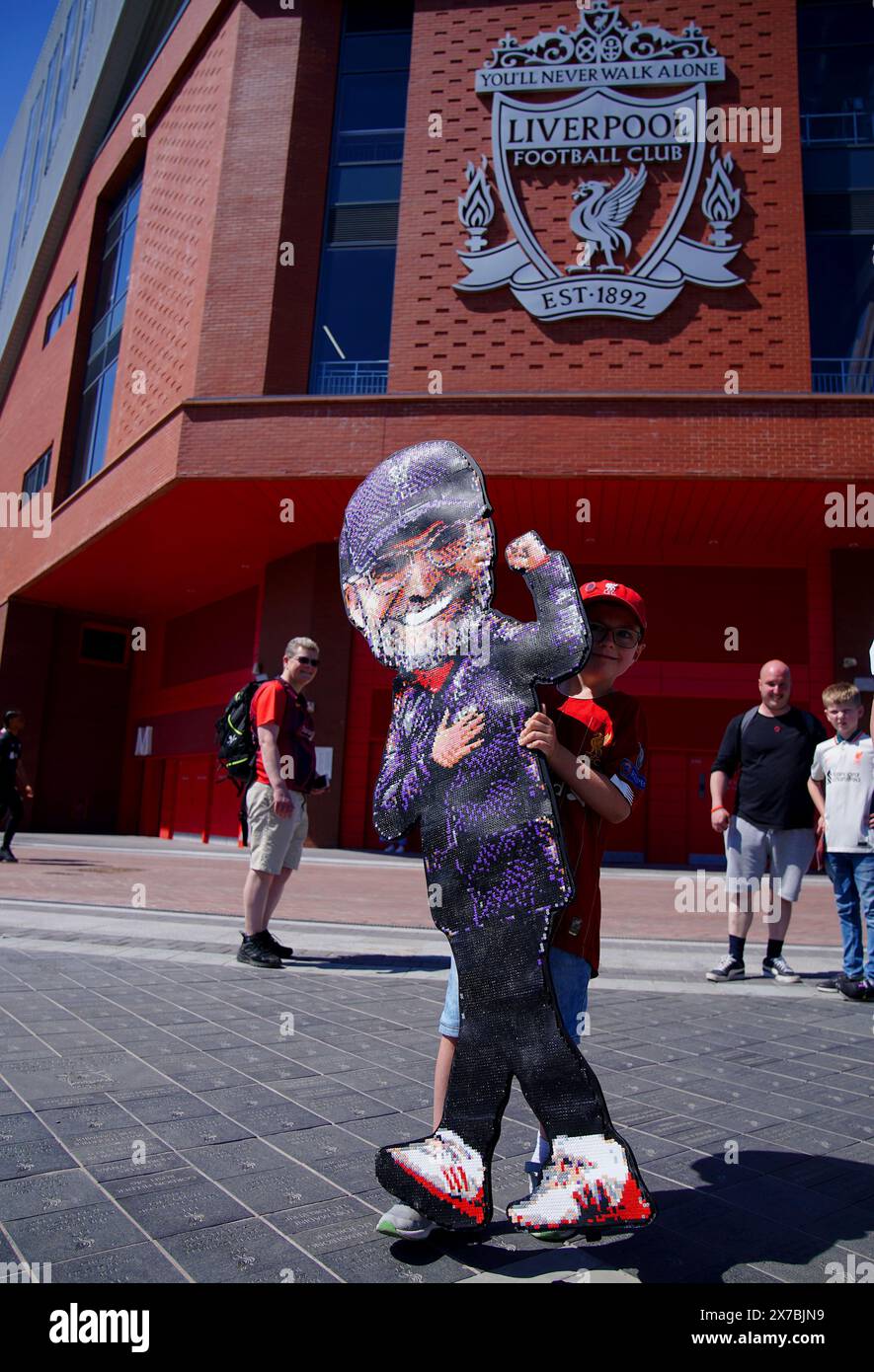 A Liverpool fan holds up a design of Jurgen Klopp made out of perler ...