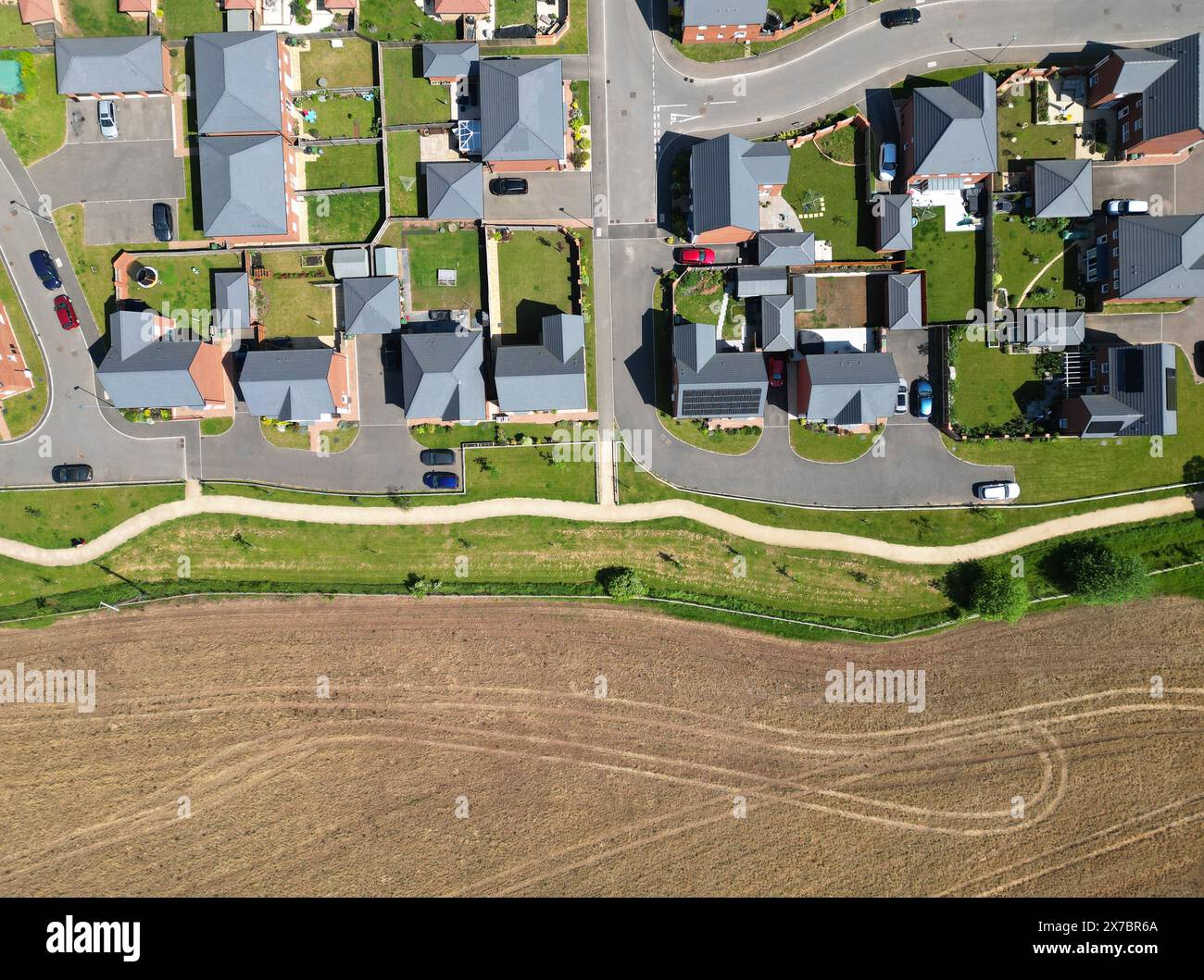 Aerial view from drone of new build housing development estate next to ...