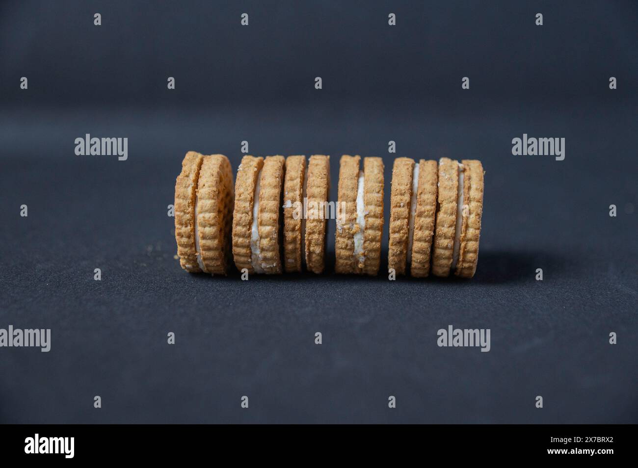 Cream biscuit on black background.sweet concept Stock Photo - Alamy