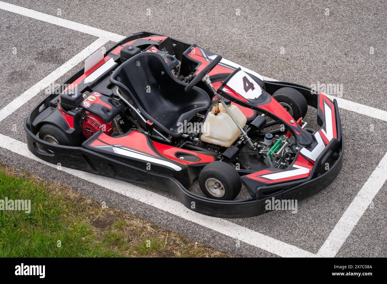 Top view of a red black go-kart on the side of a track Stock Photo - Alamy