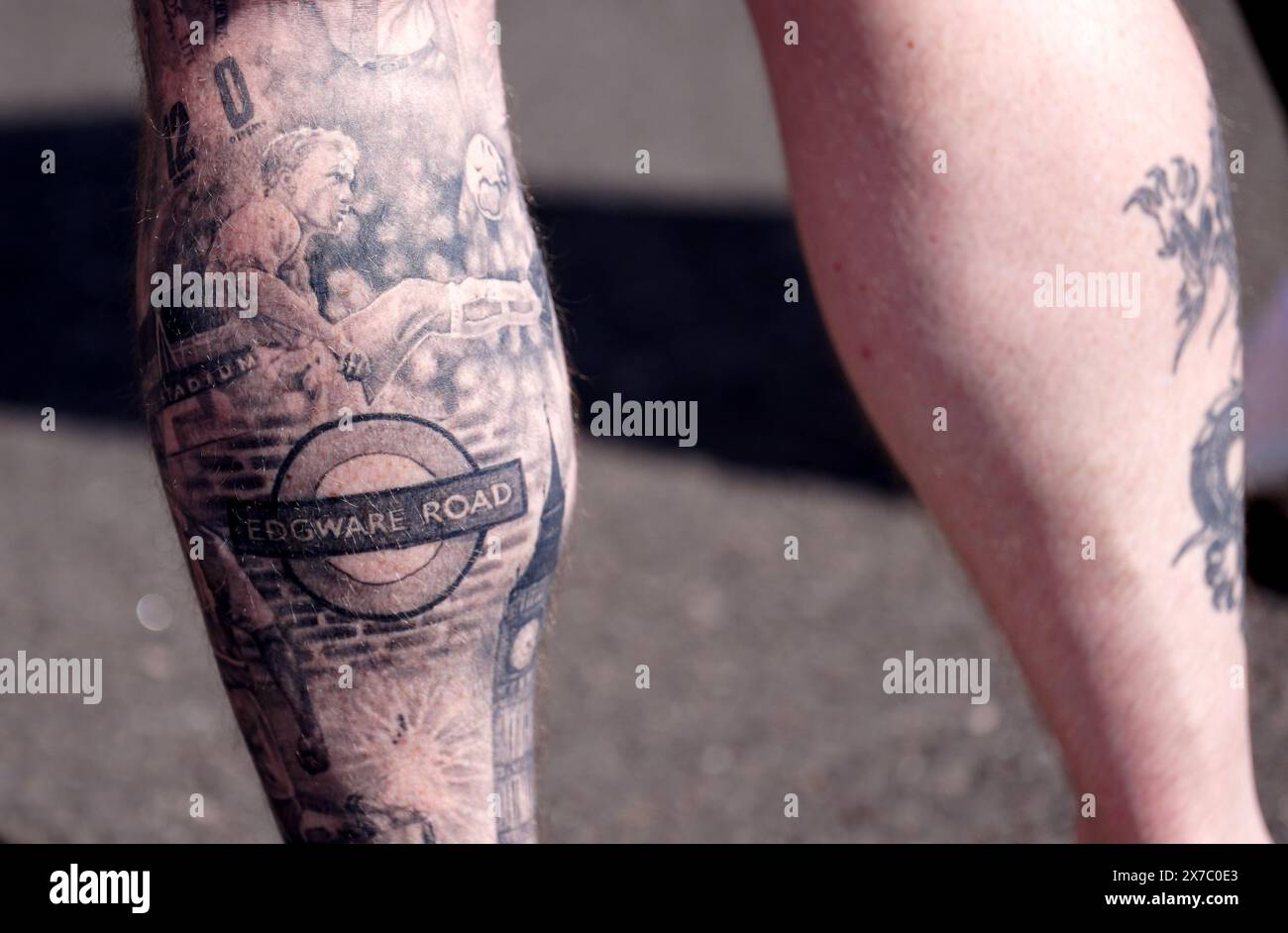 An Arsenal fan sports a tattoo on his leg ahead of the Premier League ...