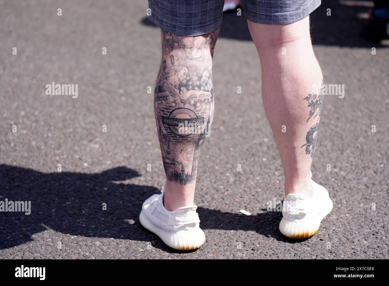 An Arsenal fan sports a tattoo on his leg ahead of the Premier League ...