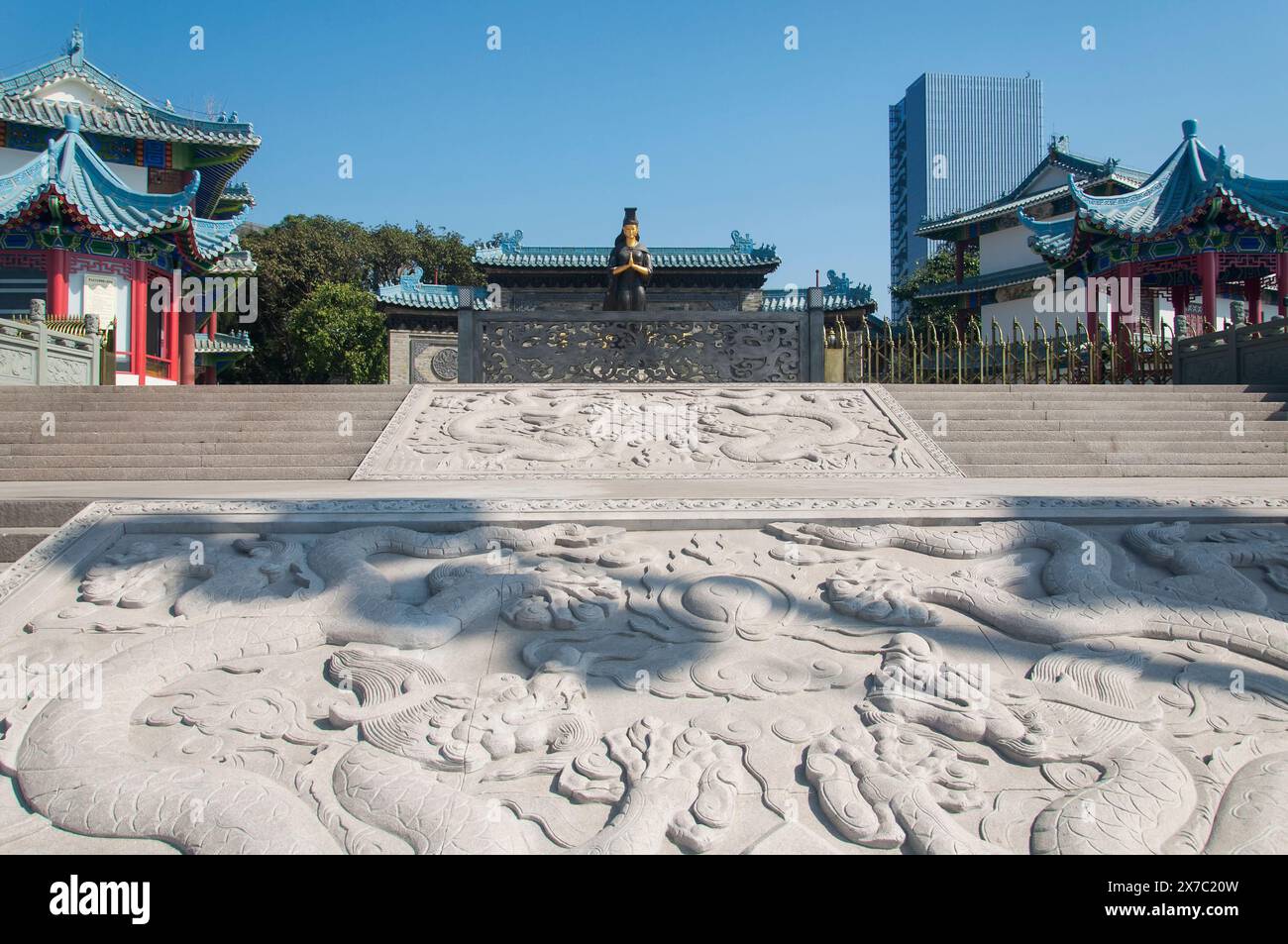 A large stone dragon mural in front of the goddess of the sea, Tian Hou, at the Chiwan Tian hou ...