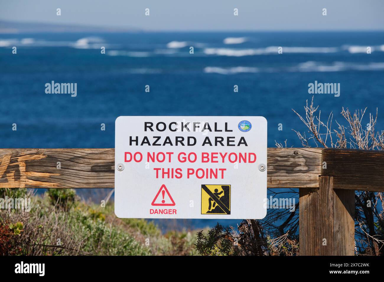 A sign indicating a Rockfall Hazard Area advising Do Not Go Beyond This ...